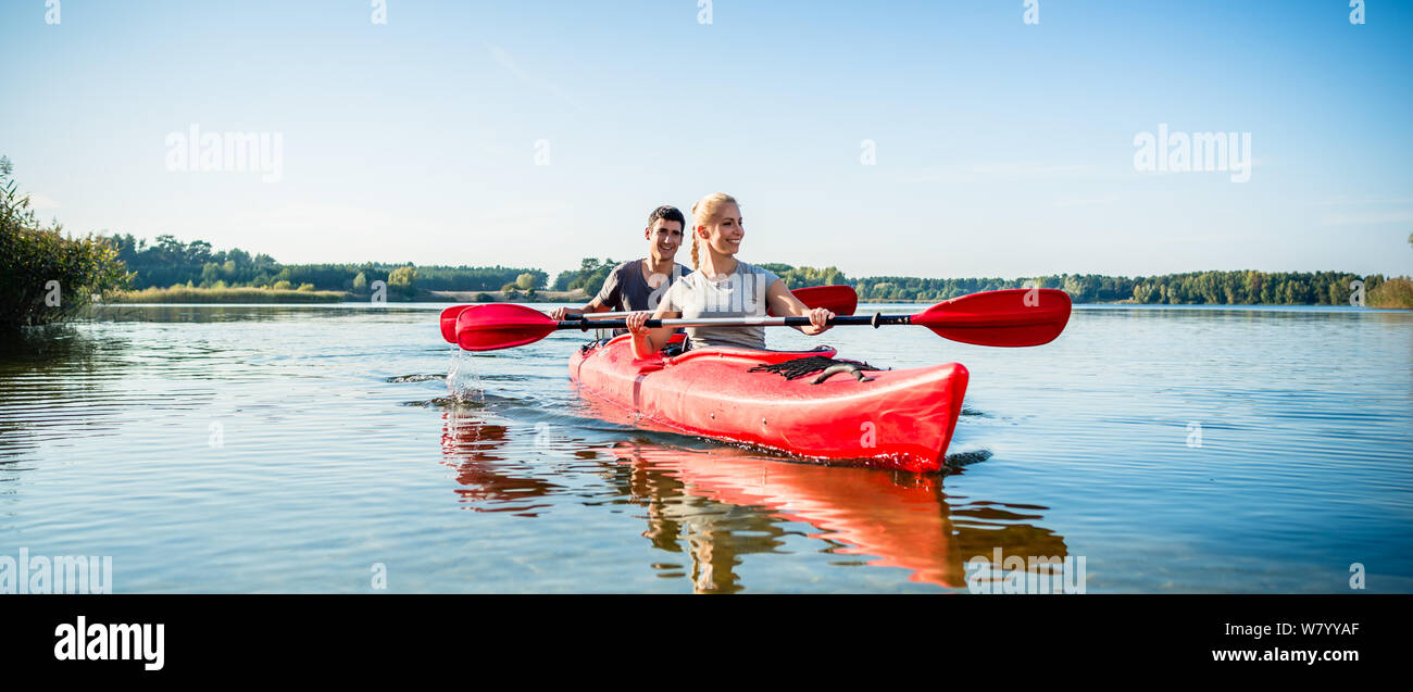 Young couple sit together look hi-res stock photography and images - Alamy