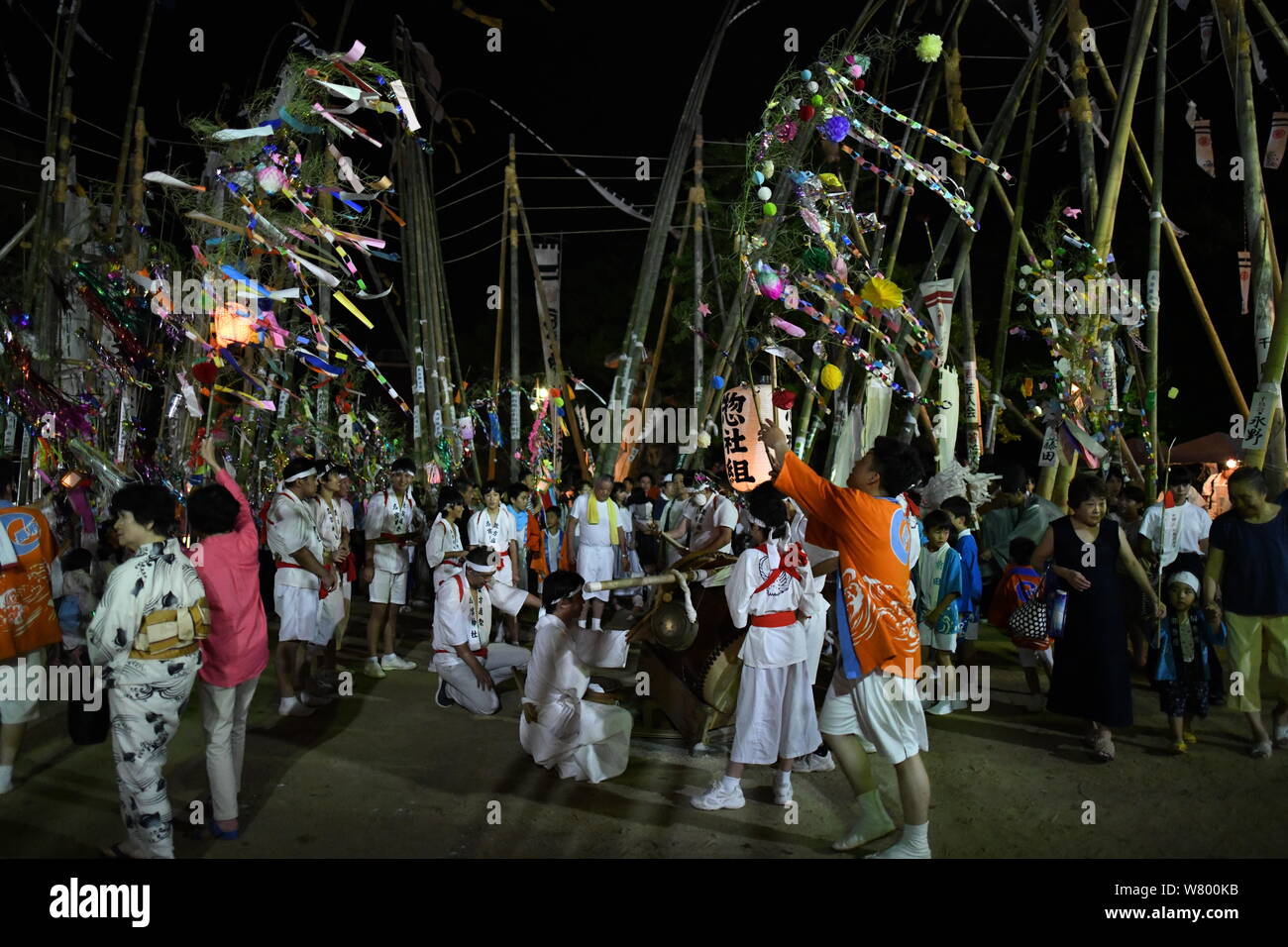 SHIMONOSEKI, JAPAN - AUGUST 07: People walk with tanabata ornaments at ...