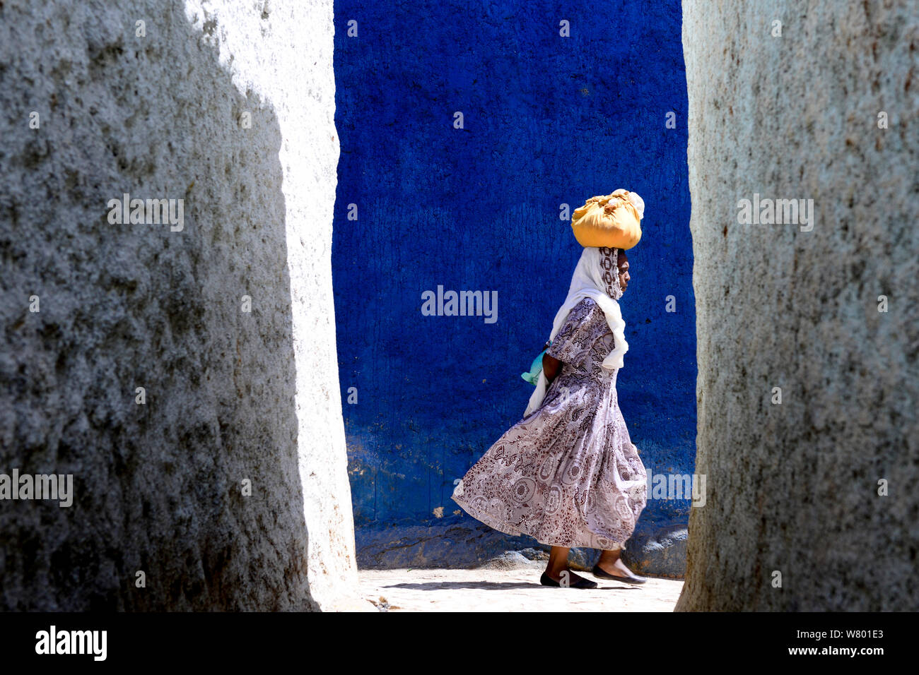 Women walking through the colourful narrow streets of Harar, an ...