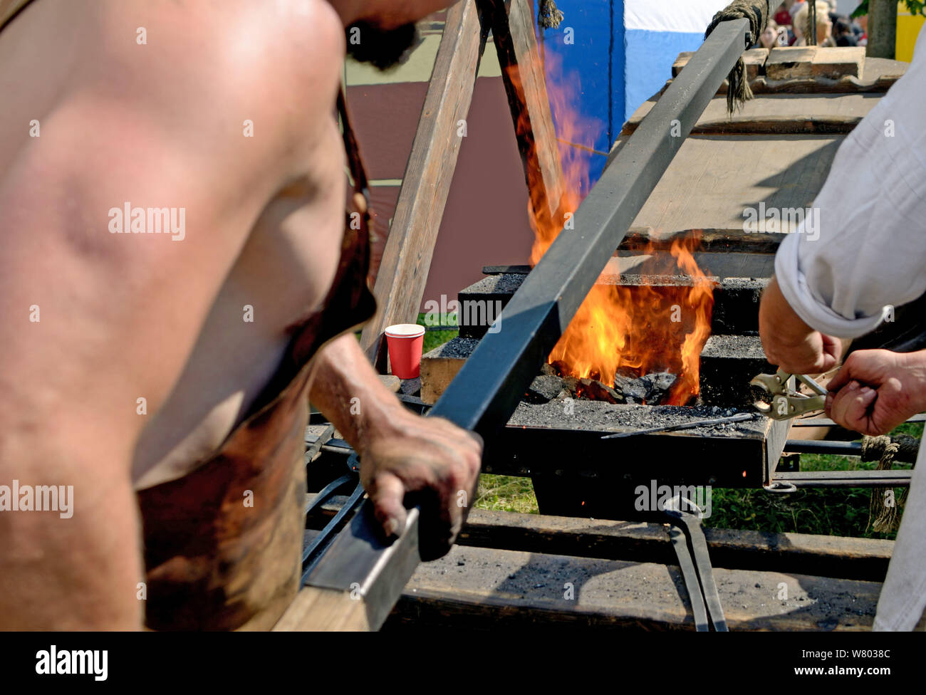 the blacksmith is a master of metal processing.He forges hot metal, and ...