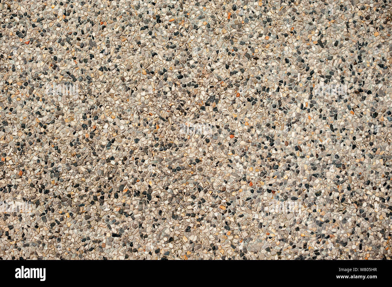 Small stones and sand in concrete. Background for landscape design ...