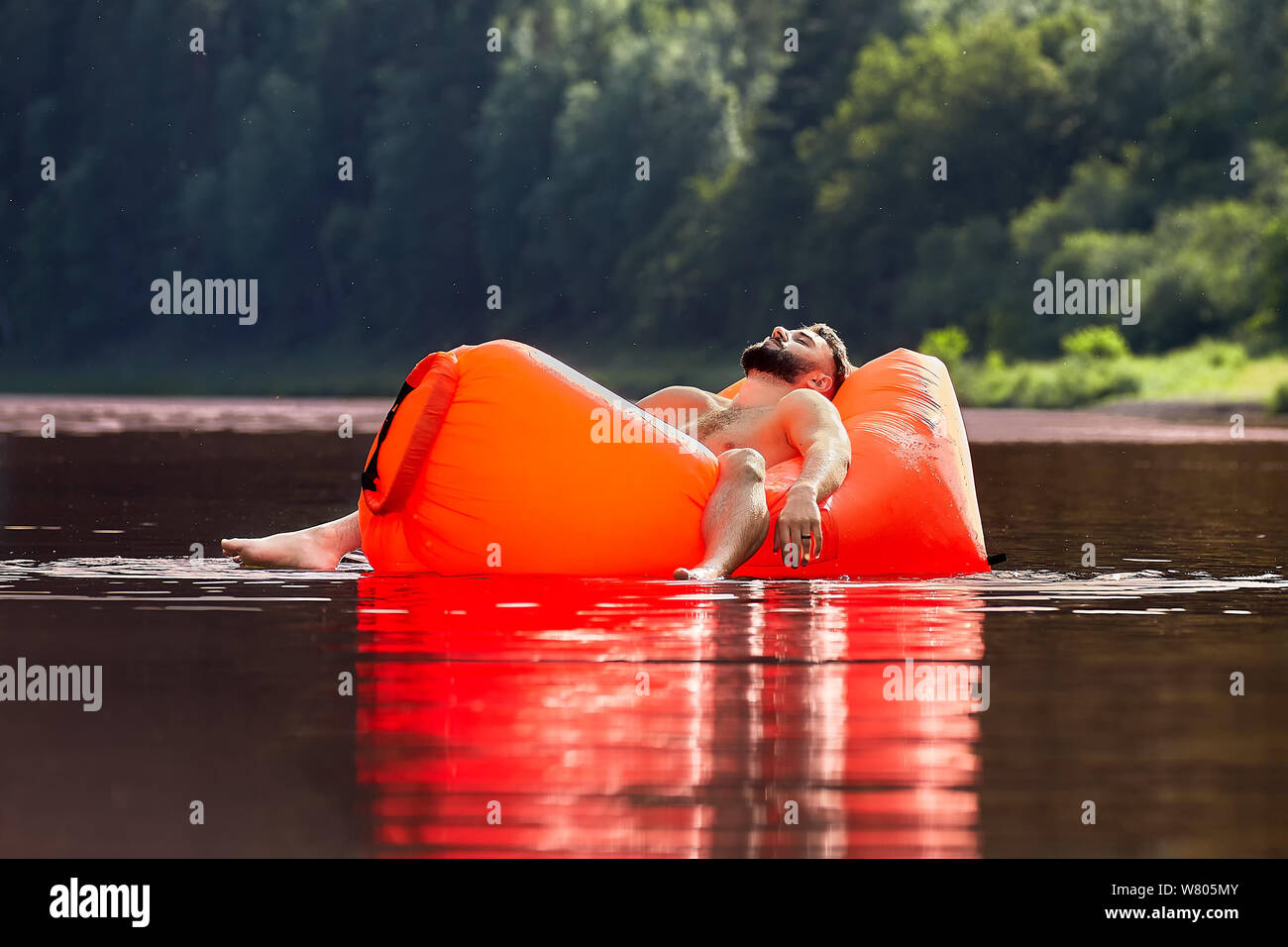 Man sleeping in inflatable boat hi-res stock photography and images - Alamy