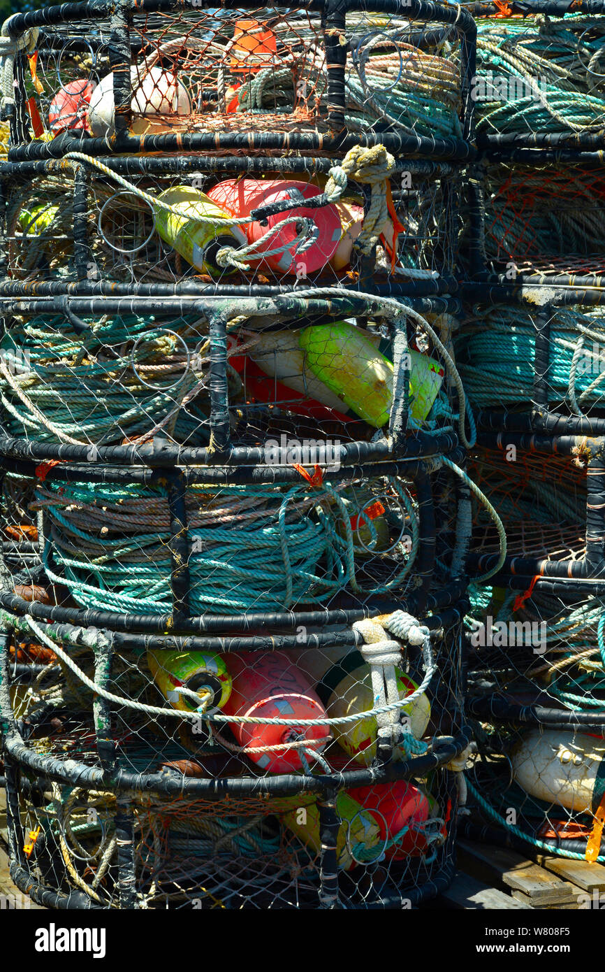 Crab trap floats and buoys pilled on a commercial fishing vessel in a ...