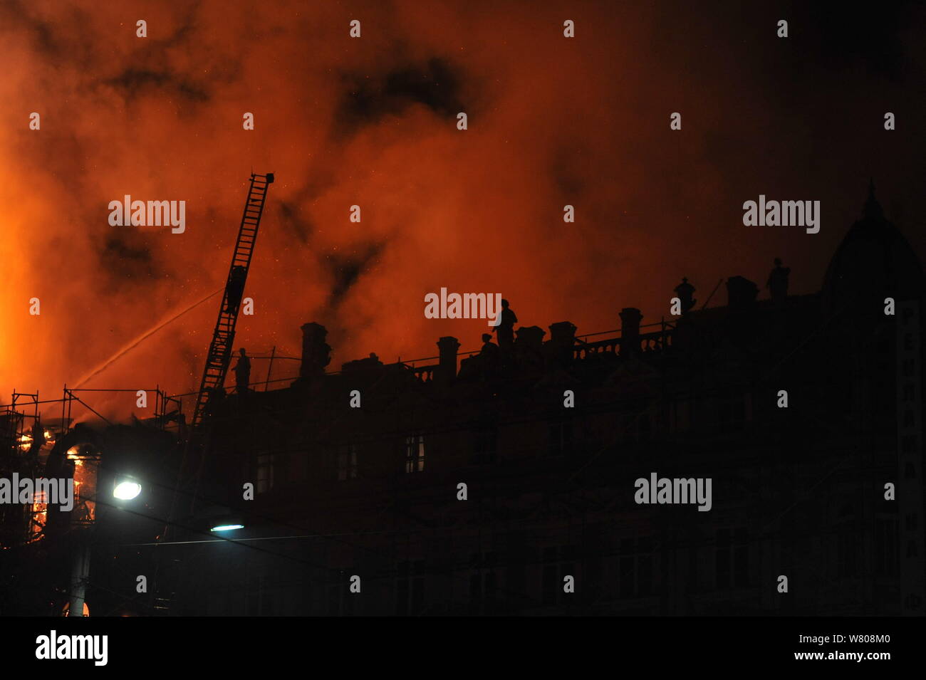 Big fire at night. Old building burns at night Stock Photo - Alamy
