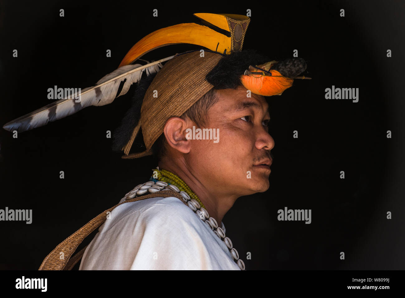Nyshi man inside Nyshi Long House, Nyshi Tribe, Arunachal Pradesh.North ...