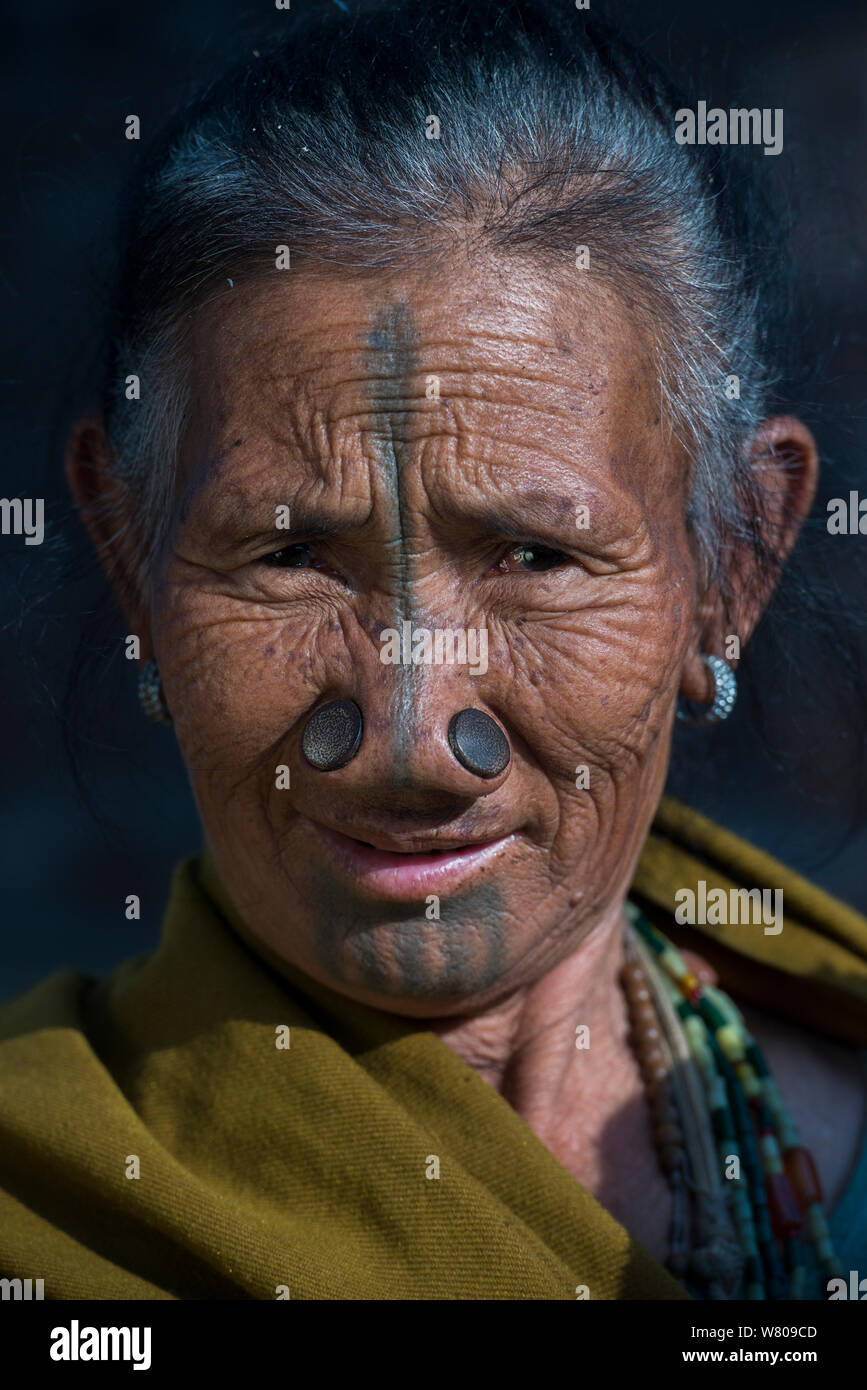 Apatani woman with facial tattoos and traditional cane nose plugs ...