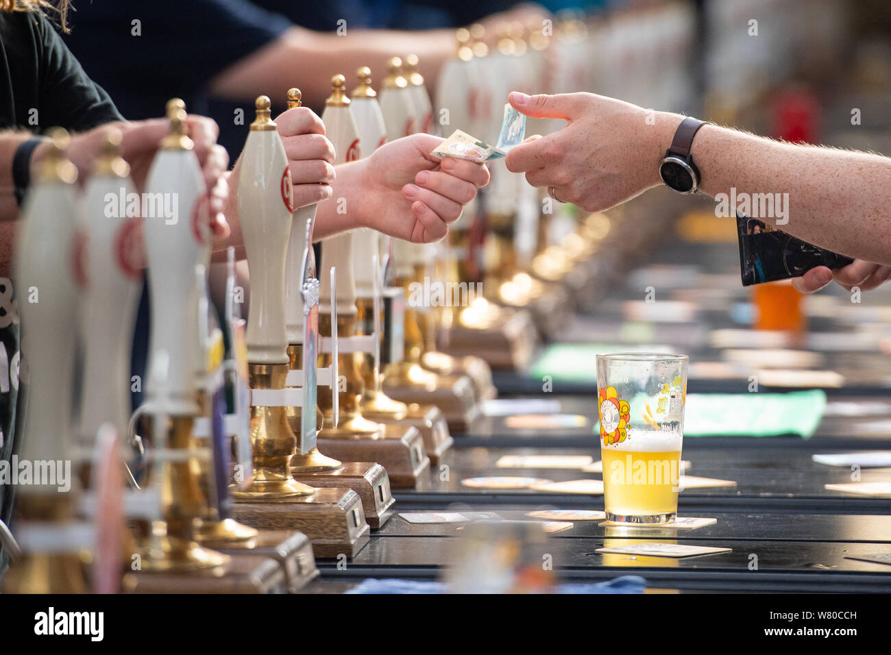 Bar staff serve drinkers at the Great British Beer Festival 2019 at ...