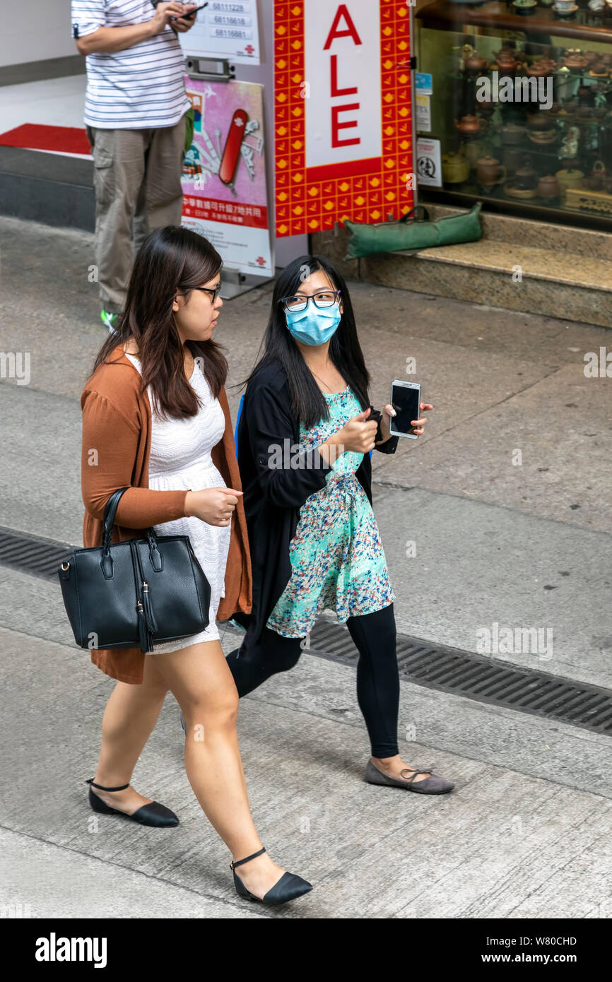 Pedestrian walking with facemask in Hong Kong, SAR, China Stock Photo ...