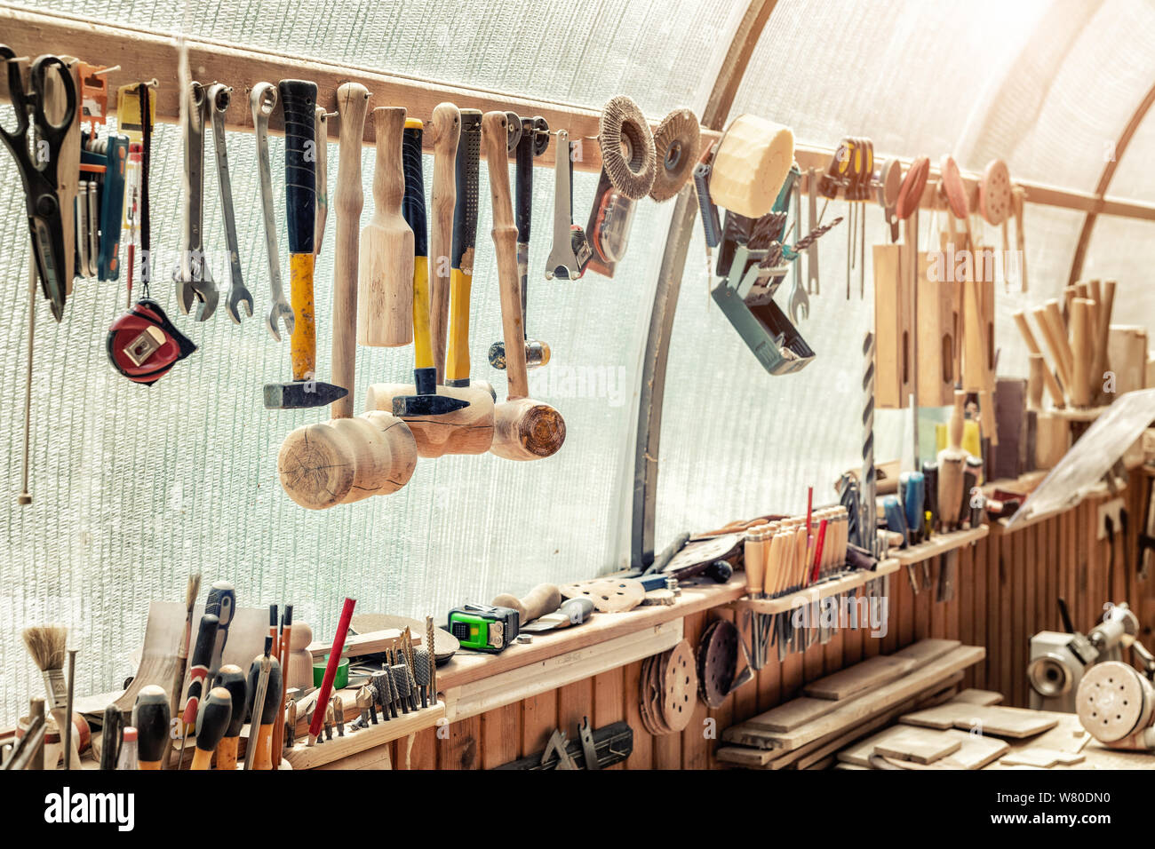 Woodwork workshop workbench with many different tools and equipment ...