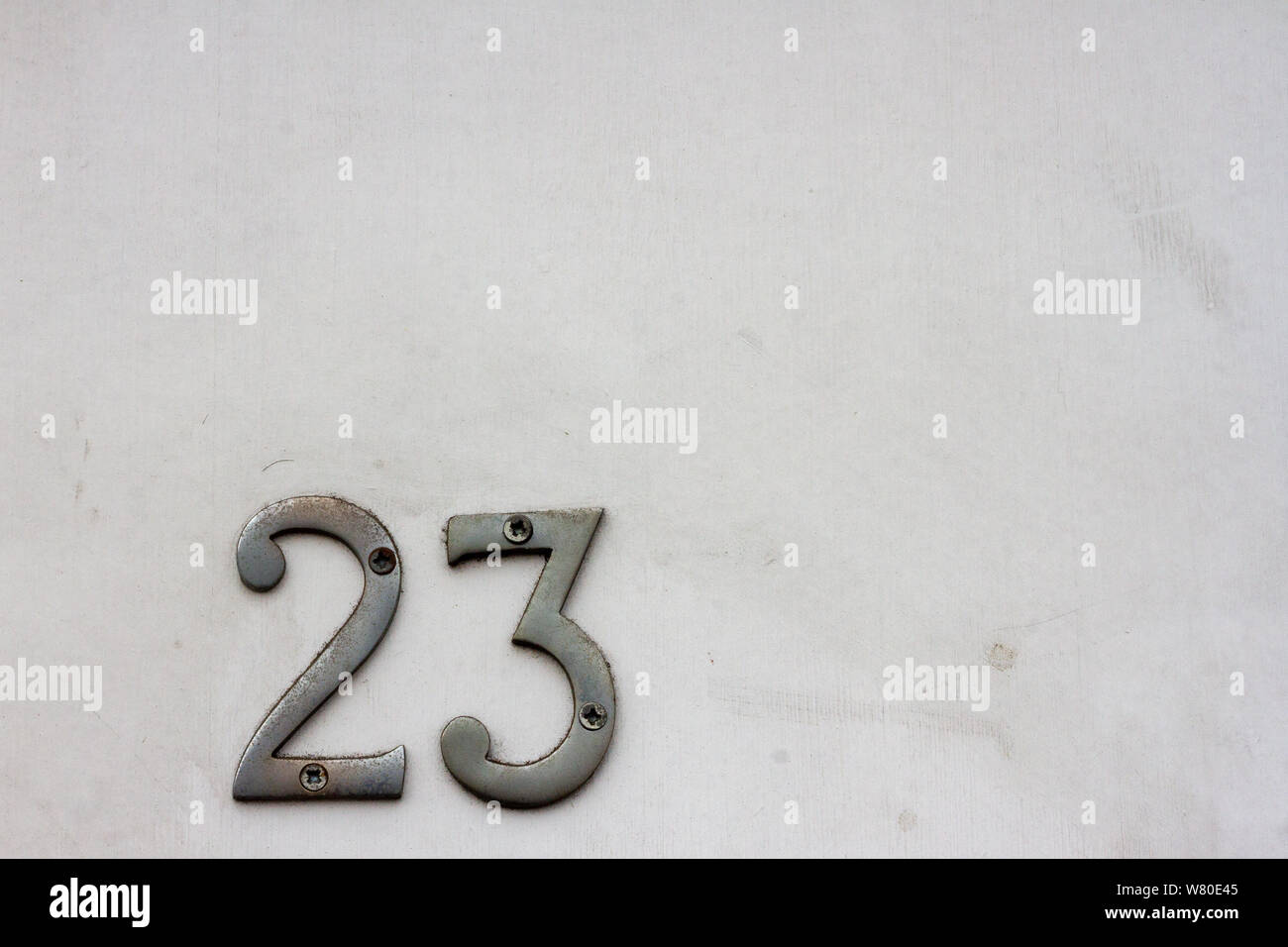 House number 23 on a white front door Stock Photo - Alamy