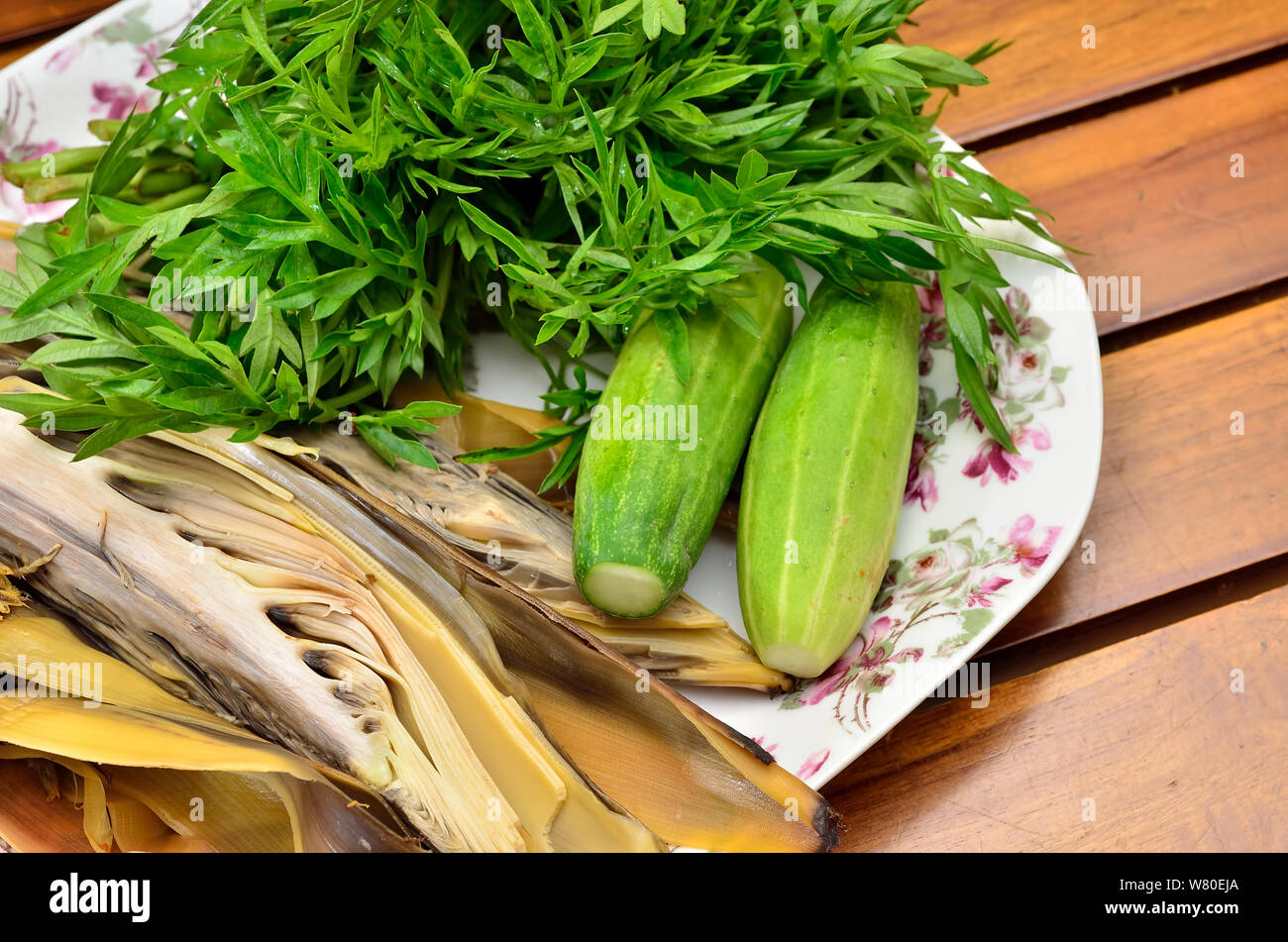 Malay traditional food. Cosmos caudatus with edible banana flower and ...