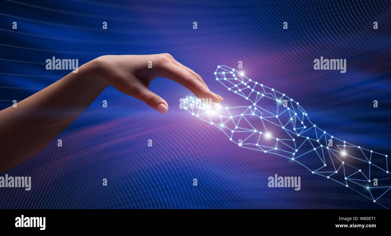 Touch To Future. Human And Robot Hands Stock Photo - Alamy