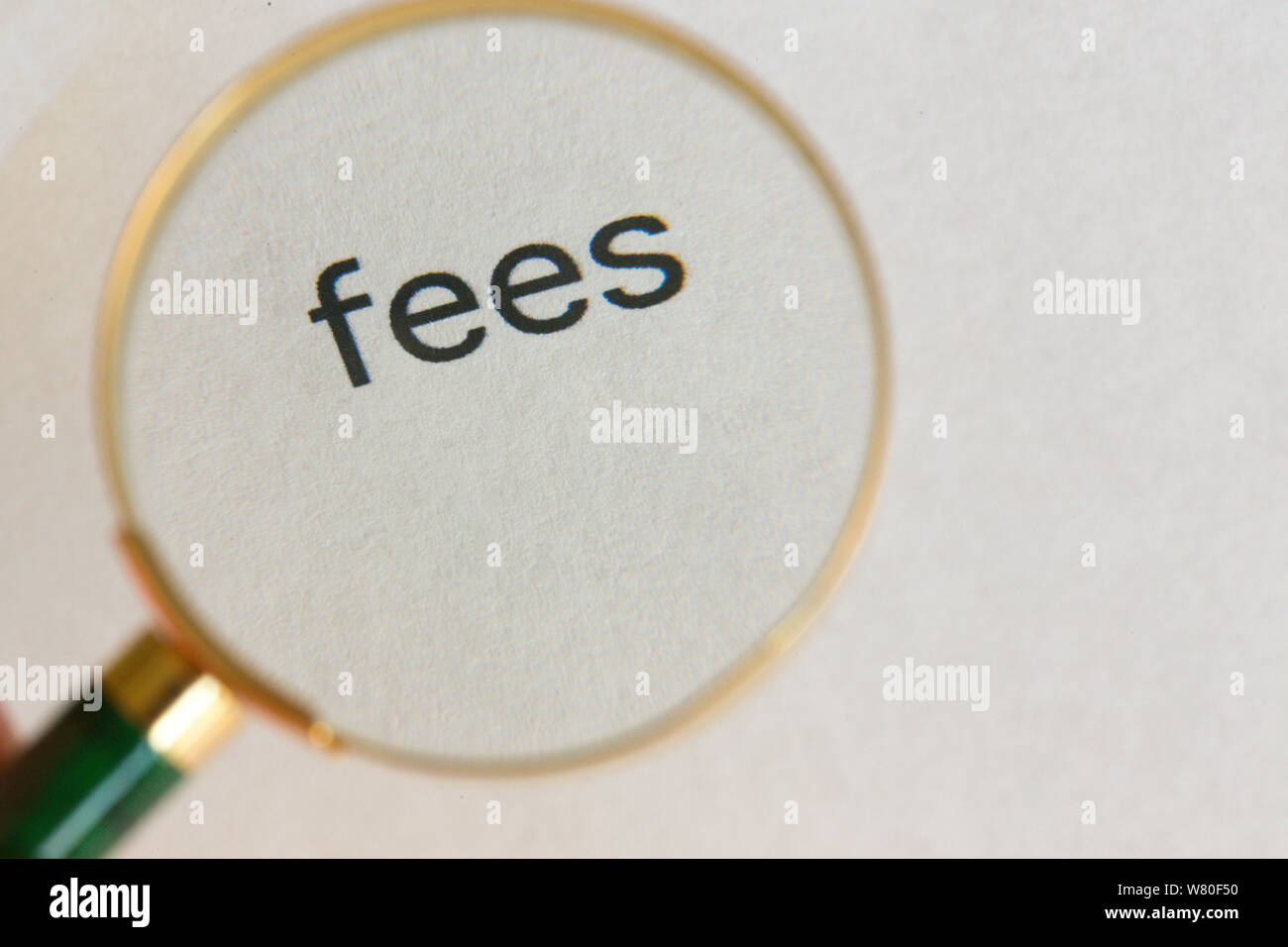 Close Up Still Life of Hidden Fees Under a Magnifying Glass, USA Stock ...