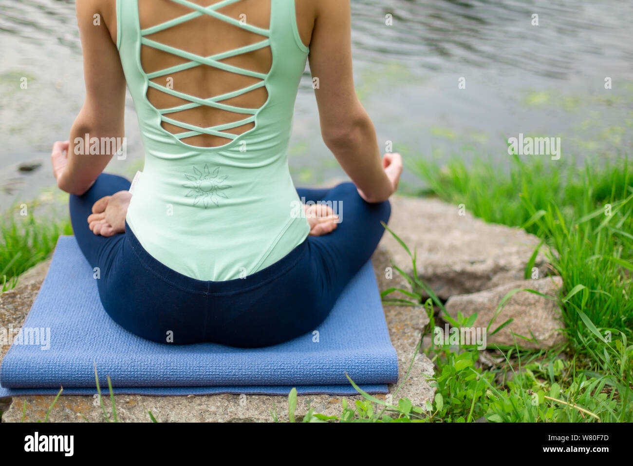 Yoga woman practicing yoga lesson, breathing, meditation, doing ...