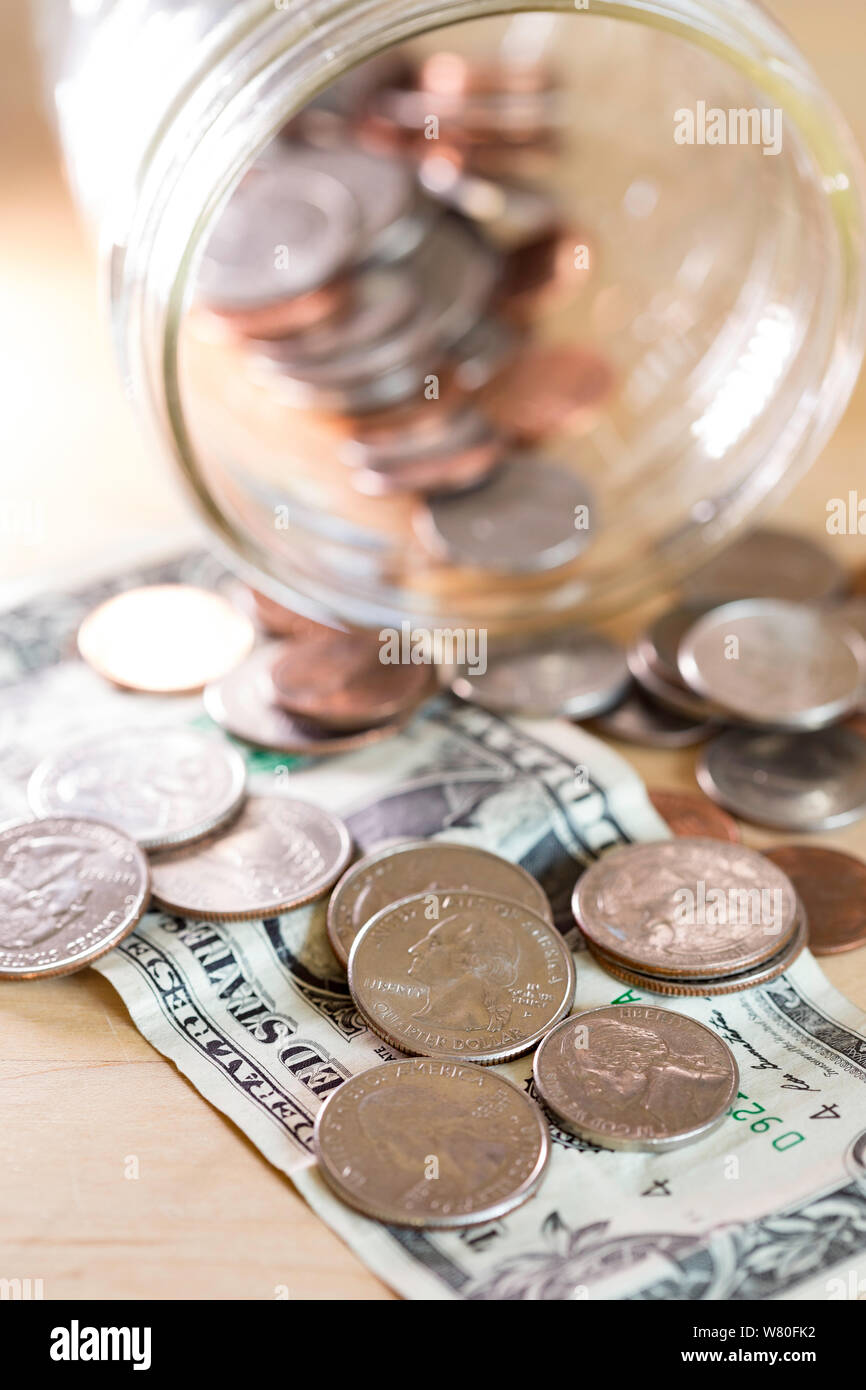 Loose Charge and Dollar Bill Spilling from a Glass jar, USA Stock Photo ...
