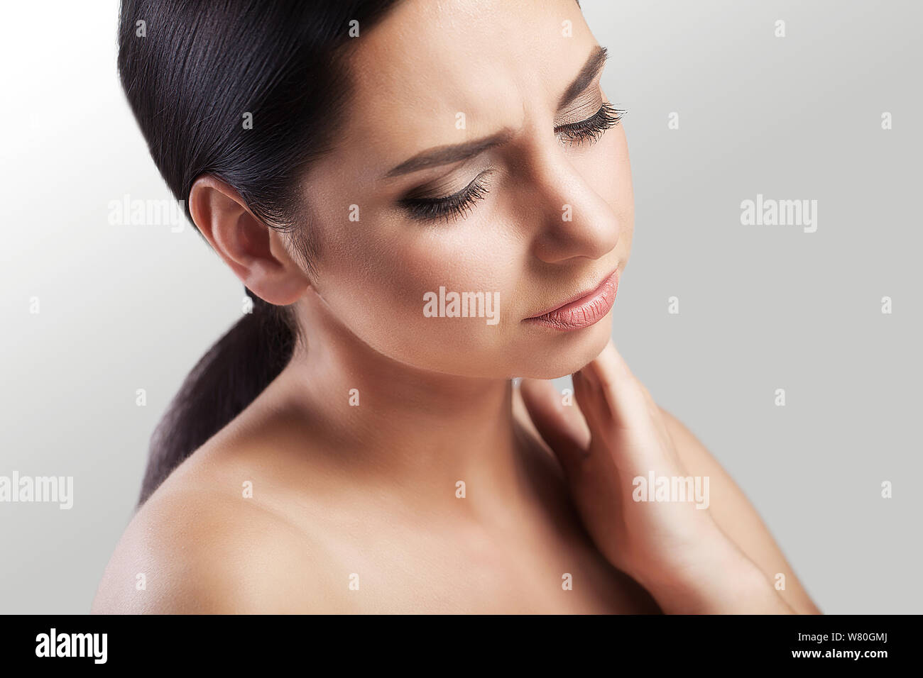 A brunette patient with an influenza disease has a throat, close-up ...