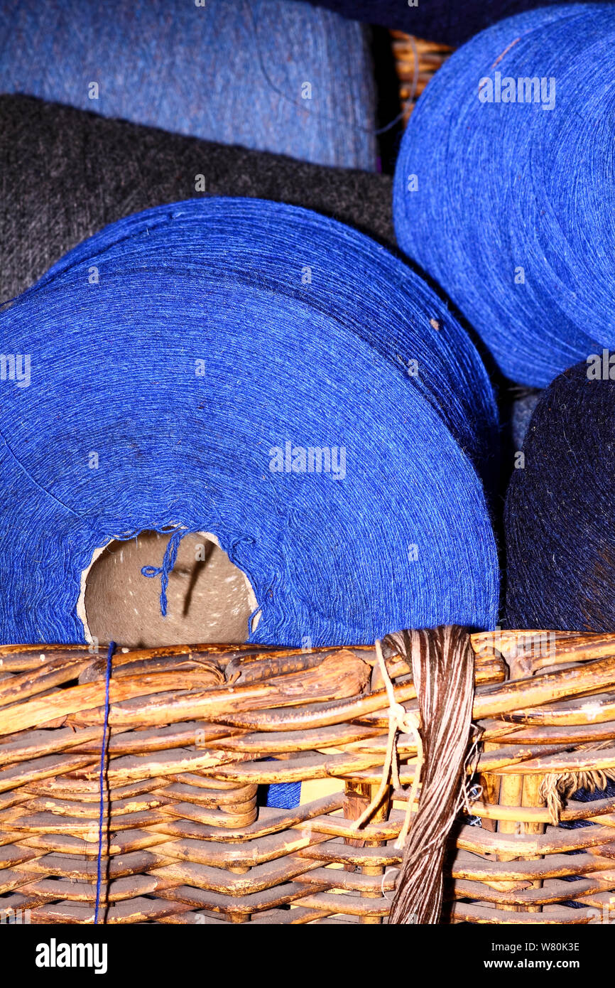 Whicker basket full of cotton bobbins in a weaving shed Stock Photo - Alamy