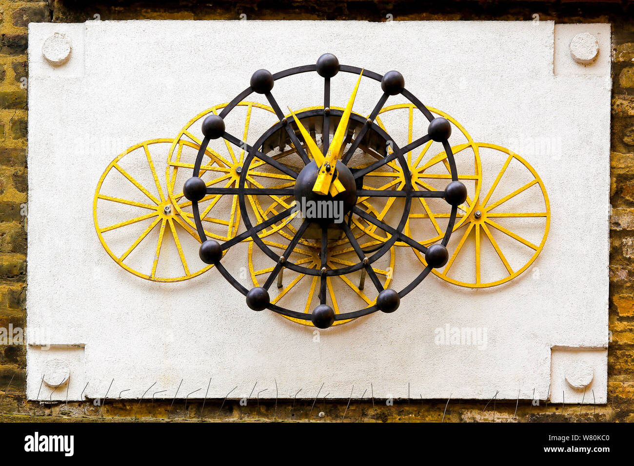 Close up shot of mechanical wheels clock Stock Photo - Alamy