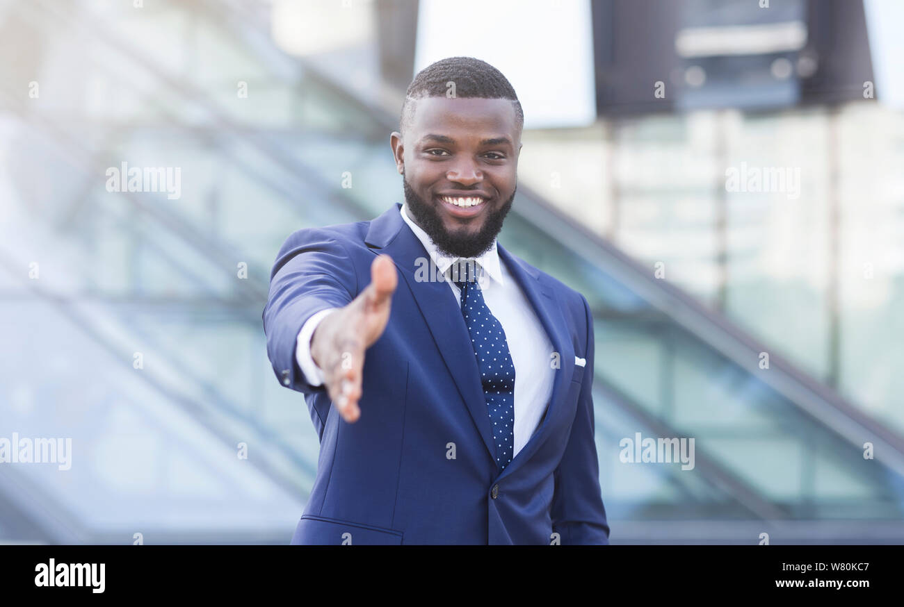 Confident Businessman Stretching Hand For Greeting In Urban Area Stock ...