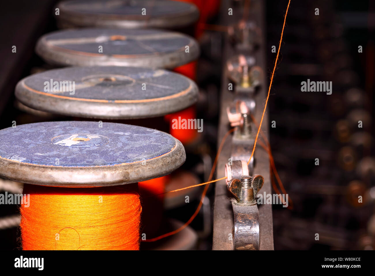Cotton bobbins on a weaving loom Stock Photo - Alamy