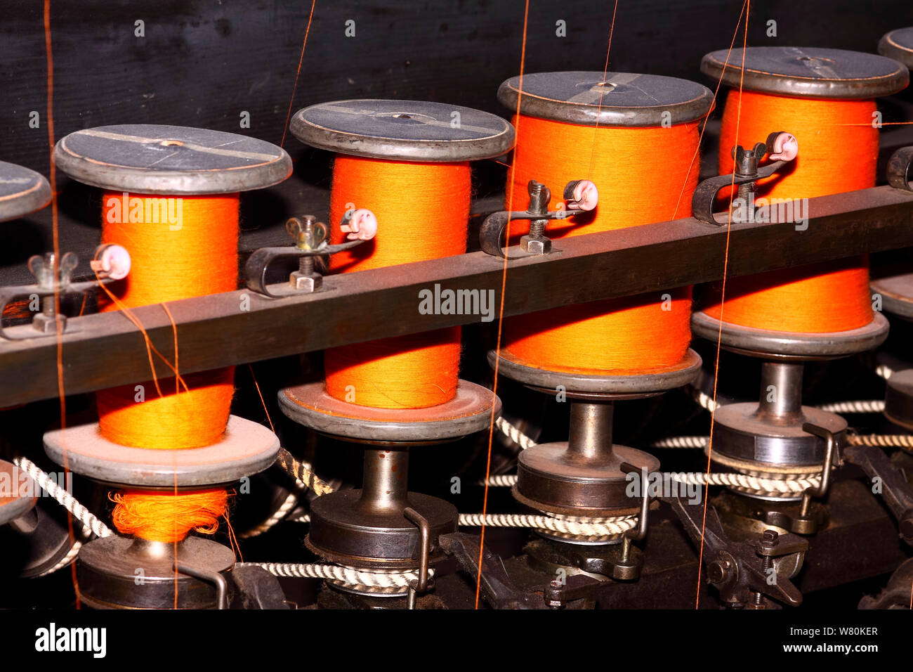 Cotton bobbins on a weaving loom Stock Photo - Alamy