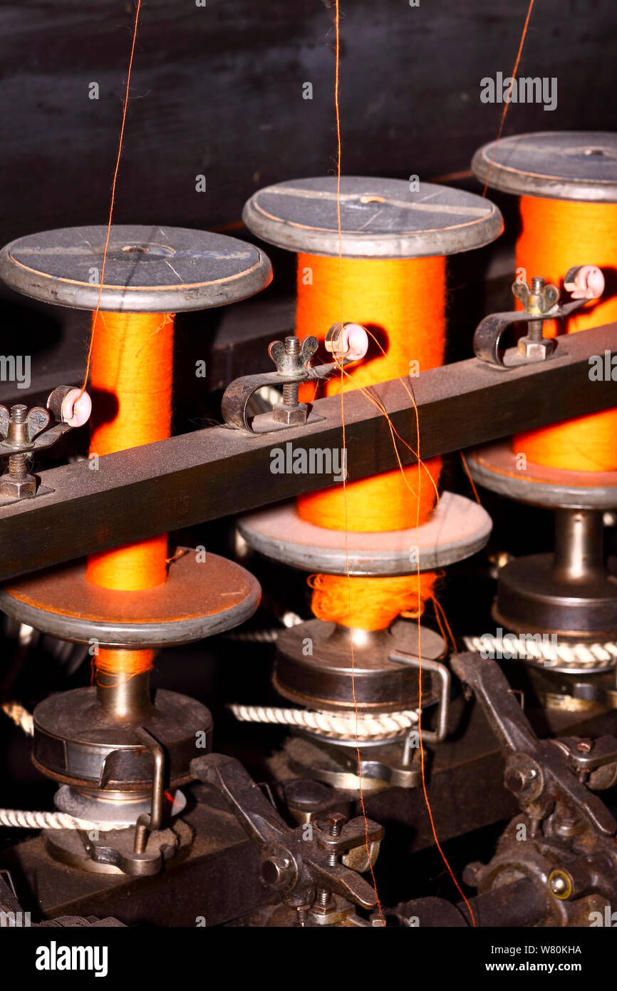 Cotton bobbins on a weaving loom Stock Photo - Alamy