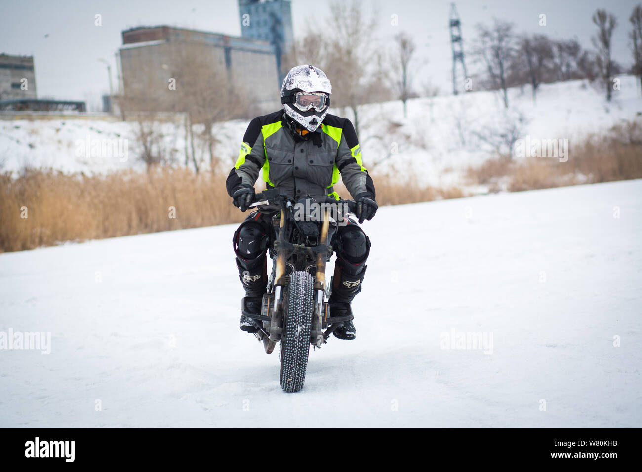 A guy rides a motorcycle on a frozen lake Stock Photo - Alamy