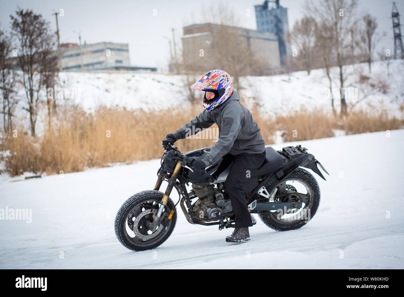 A guy rides a motorcycle on a frozen lake Stock Photo - Alamy