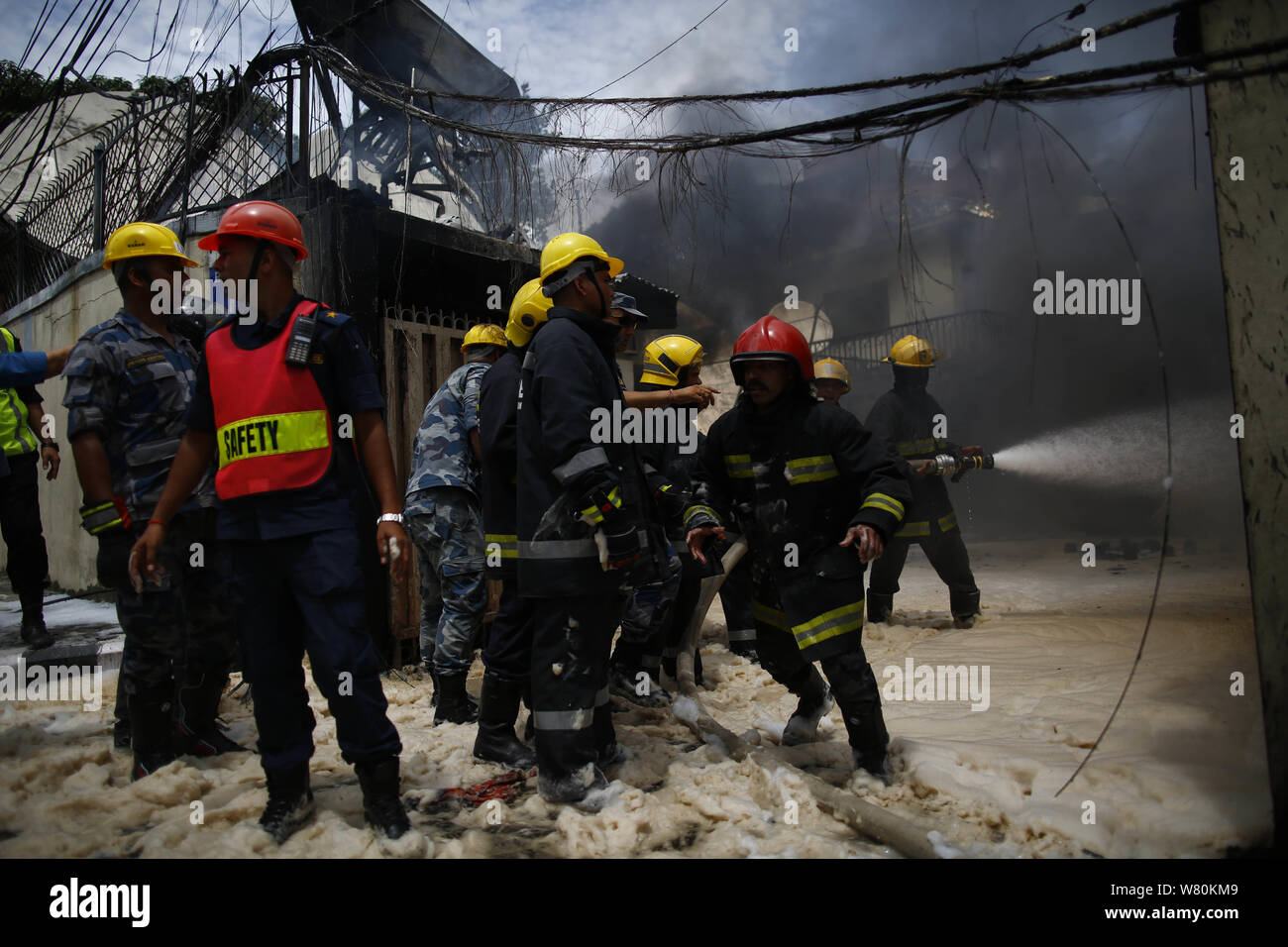 Kathmandu, Nepal. 7th Aug, 2019. Firefighters and security personnel ...