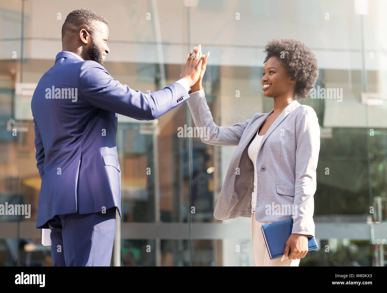 Good job partner. Businessman giving high five to his collegue Stock ...