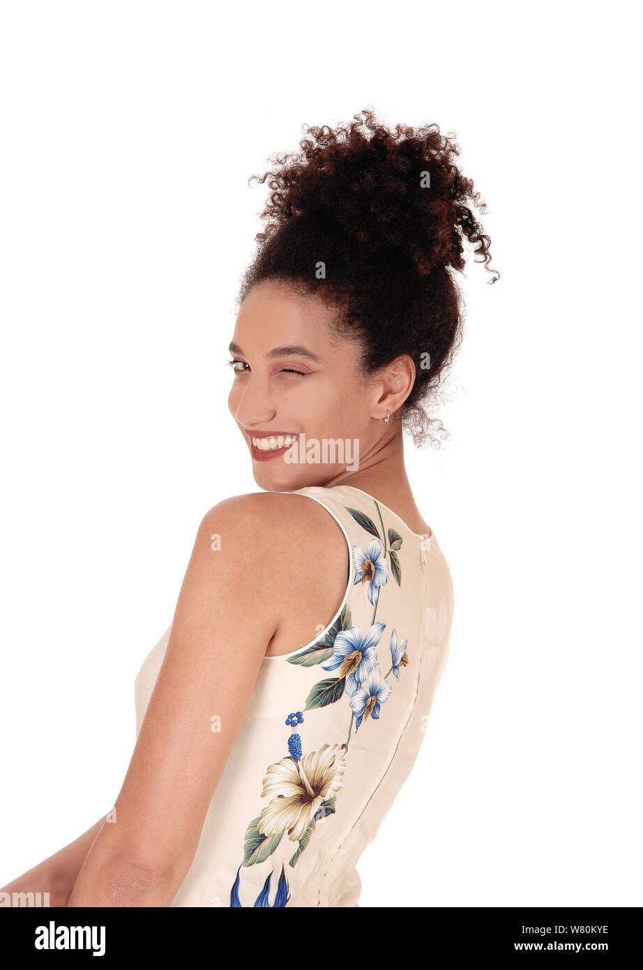 Beautiful young multi-racial woman standing in a summer dress, in a ...