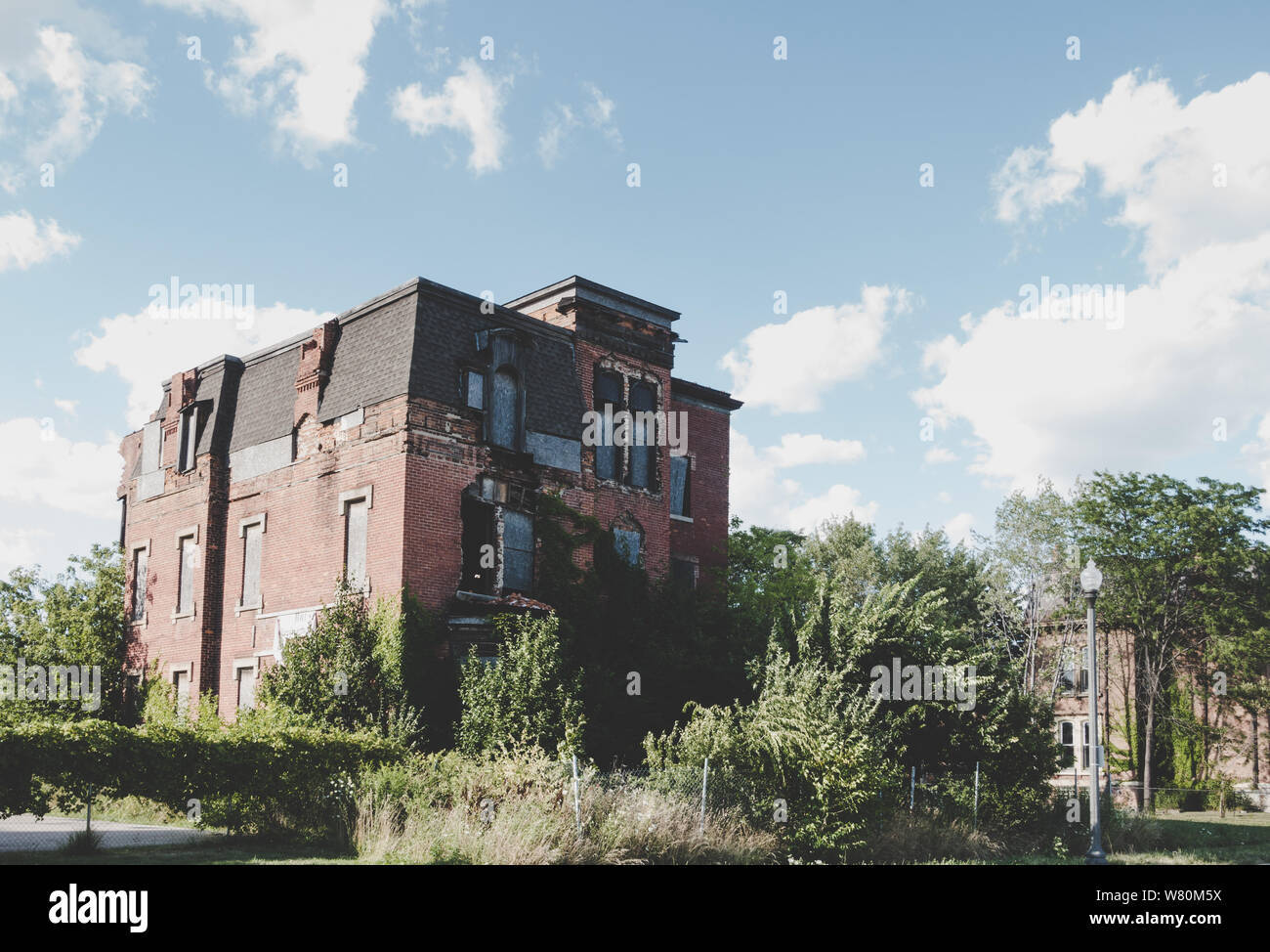 An abandoned house in the city of Detroit is taken over by plants and ...