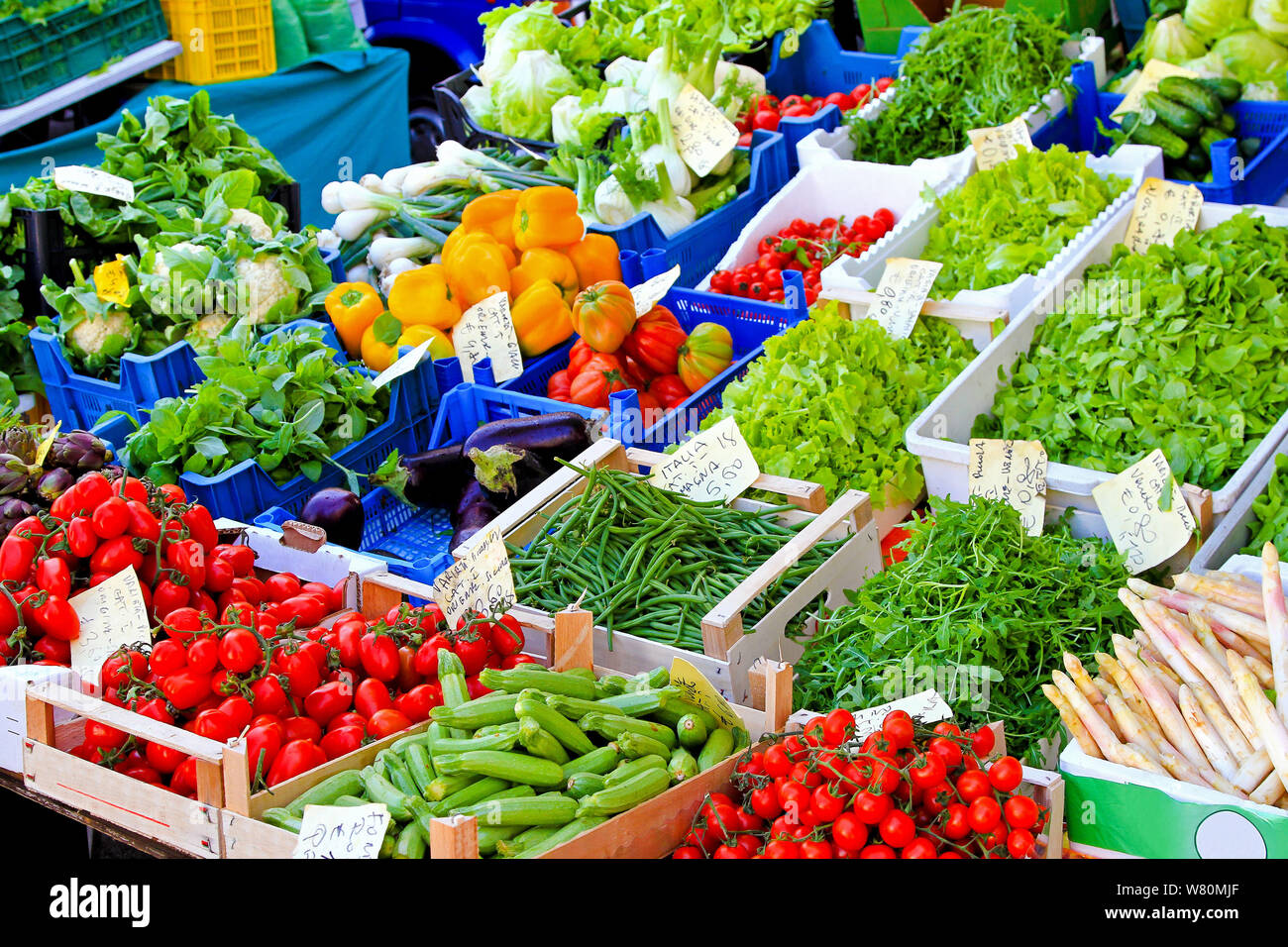 Bunch of organic vegetables sold on market stall Stock Photo - Alamy