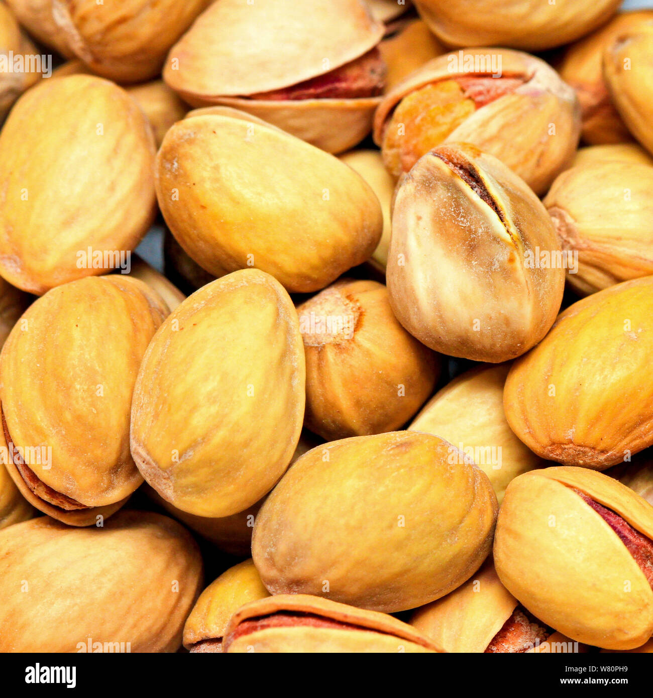 Natural organic raw pistachios with shell background Stock Photo - Alamy