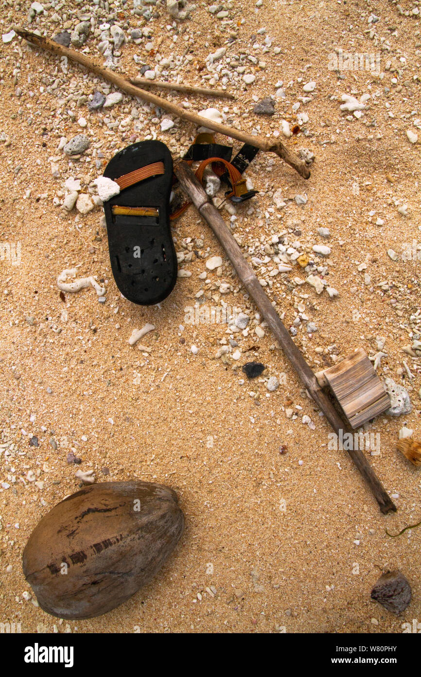 Some rubbish lay on a lovely remote island beach Stock Photo - Alamy