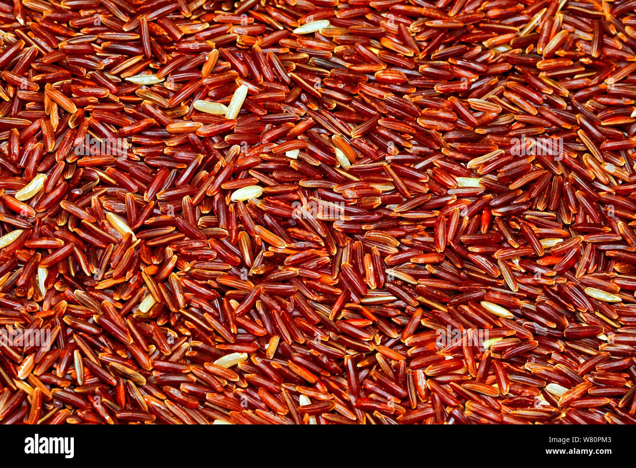 Natural organic whole red rice pattern background Stock Photo - Alamy