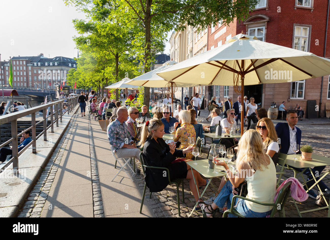 Copenhagen cafe; people drinking outside in summer sunshine, Copenhagen ...