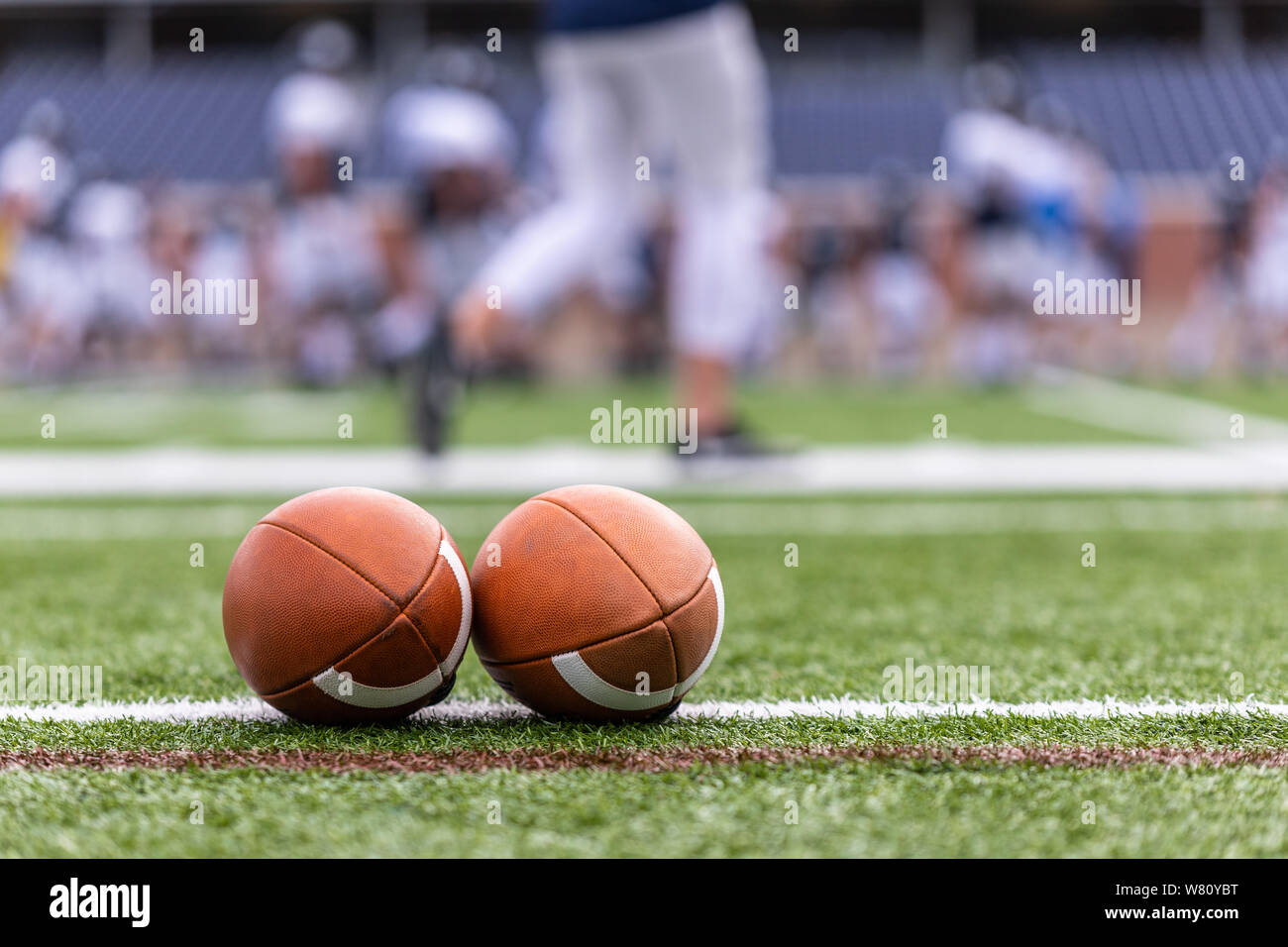 Two football balls lined up on the field line Stock Photo - Alamy