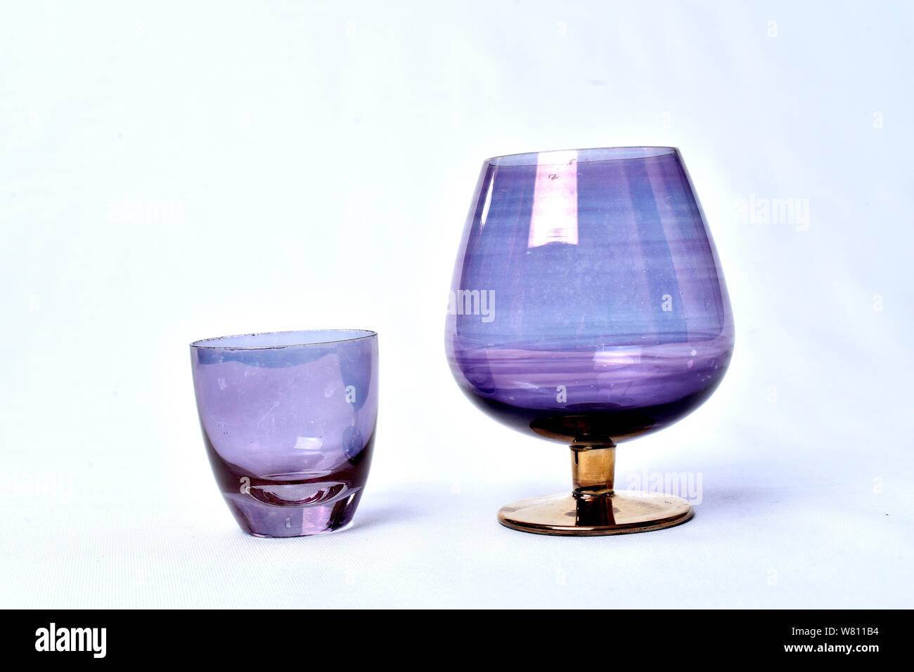 Colorful drinks glass cup on table on white background Stock Photo - Alamy