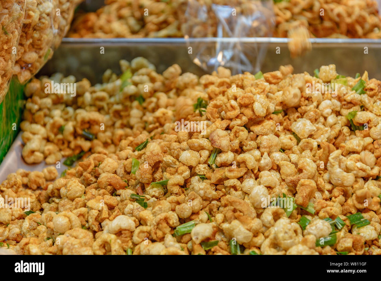 Pile of deep fried or bake pork snack, pork rind, pork scratching or ...