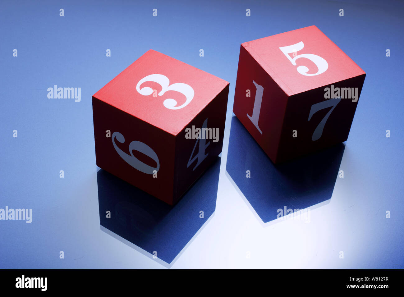 Number Cubes on Blue Background Stock Photo - Alamy