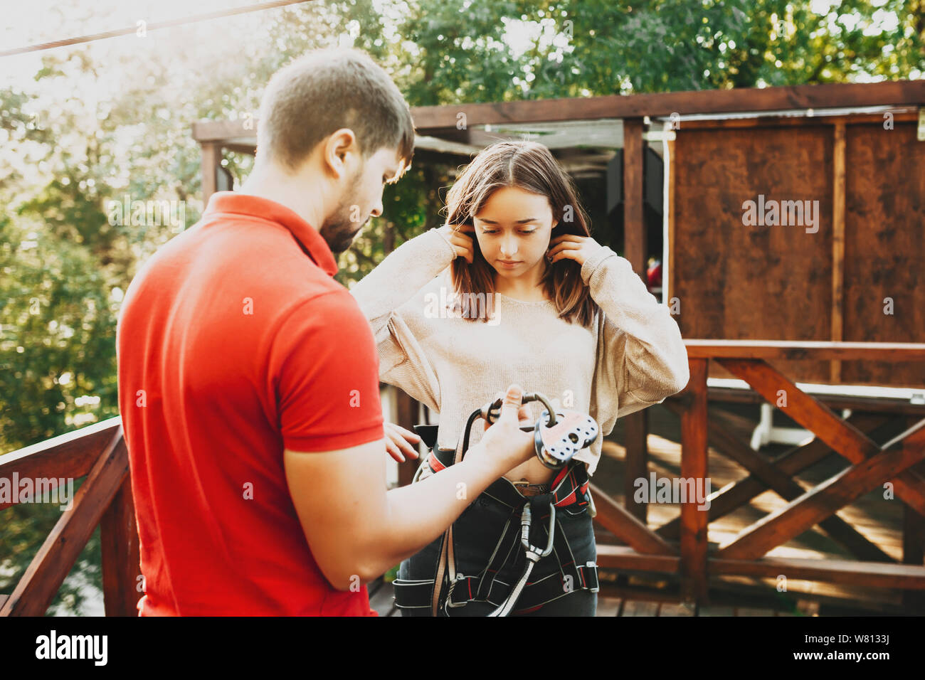Beautiful young caucasian woman picking up the hair while being ...