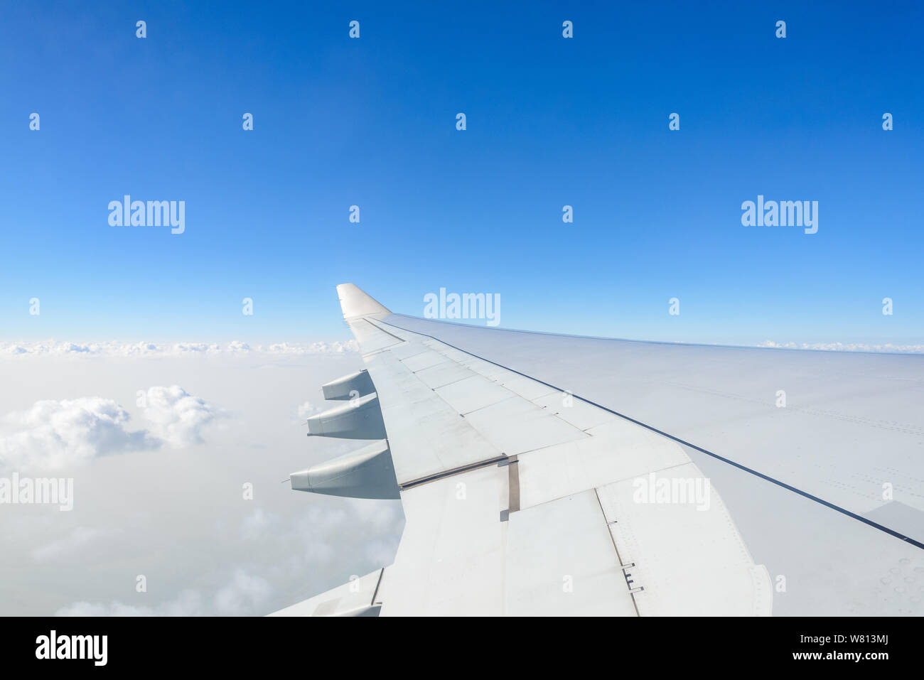 Clear deep blue sky over thick layer of blurry clouds at stratosphere ...