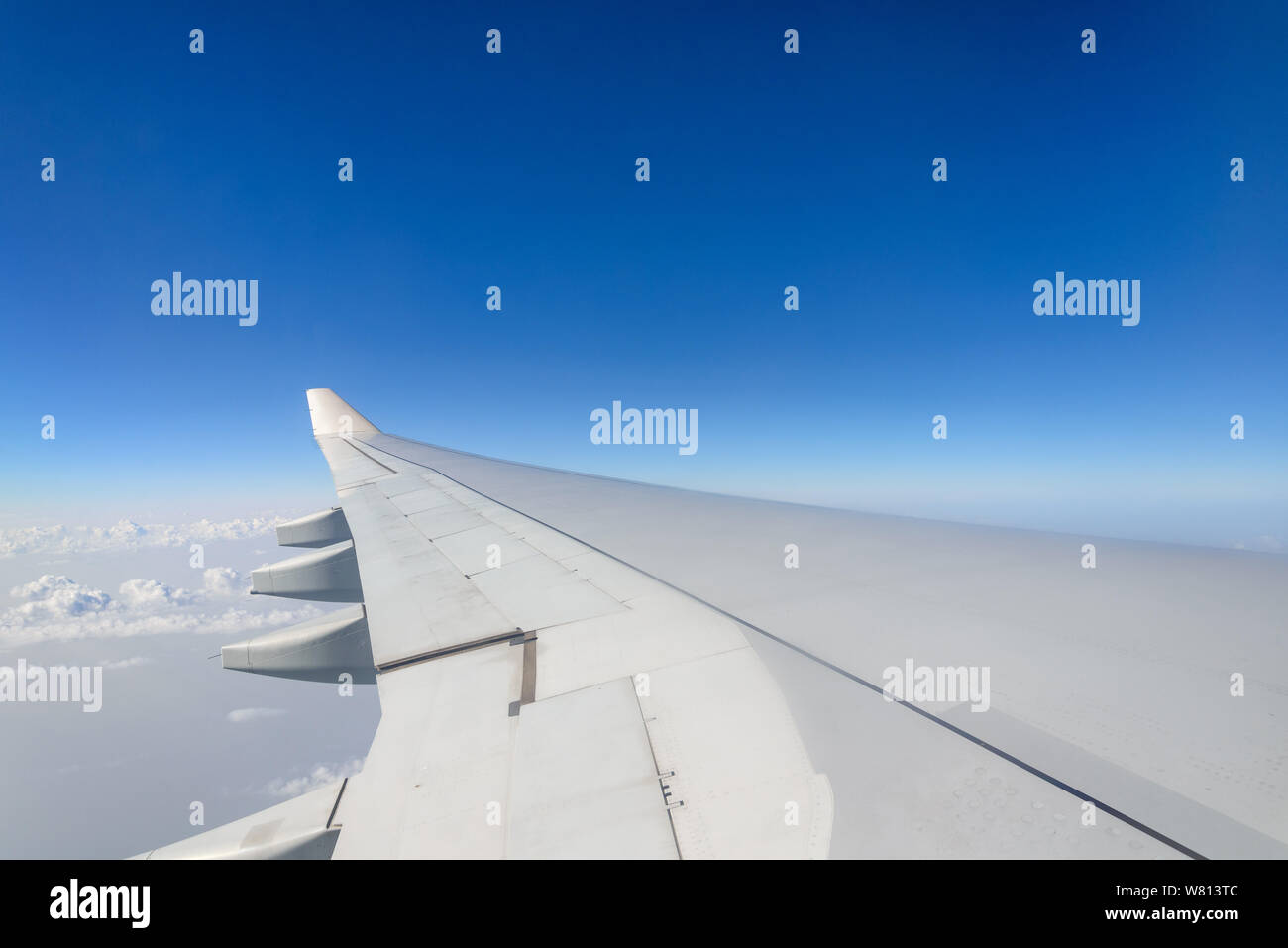 Clear deep blue sky over thick layer of blurry clouds at stratosphere ...