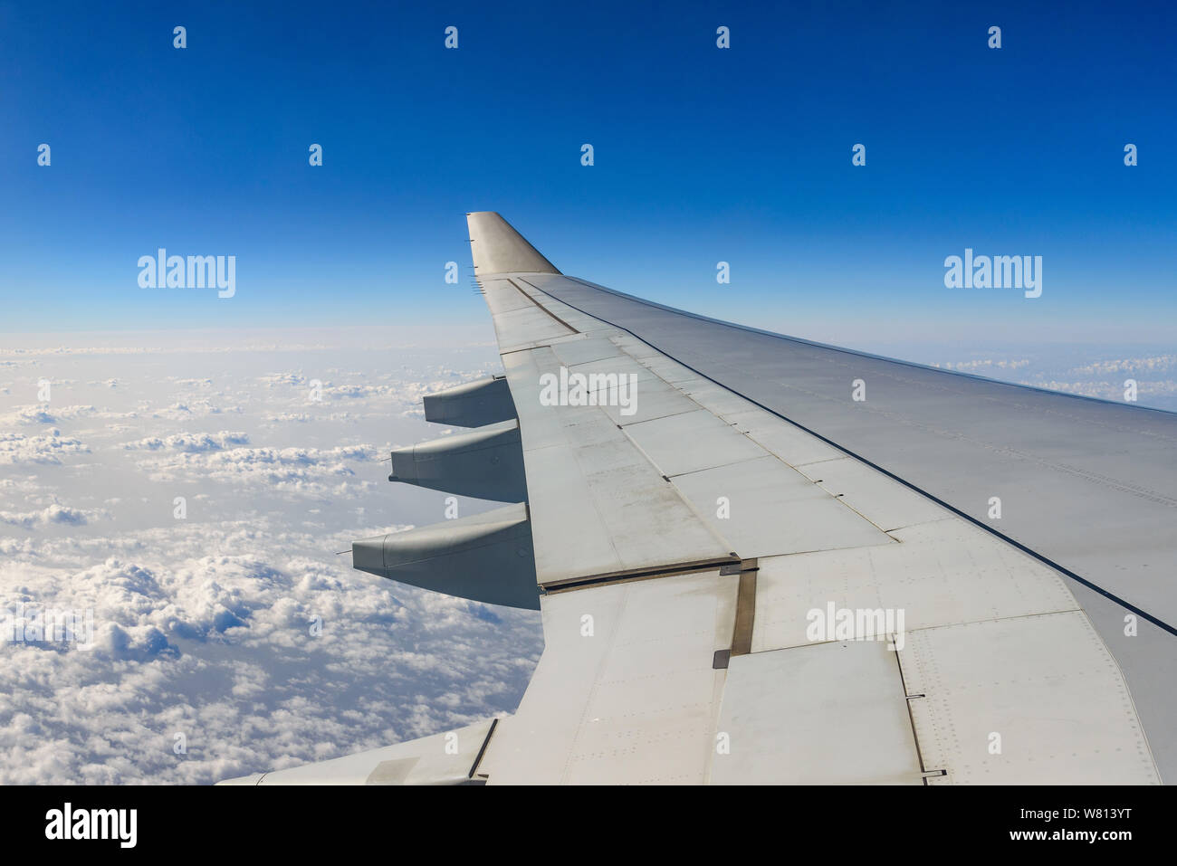 Clear deep blue sky over thick layer of blurry clouds at stratosphere ...