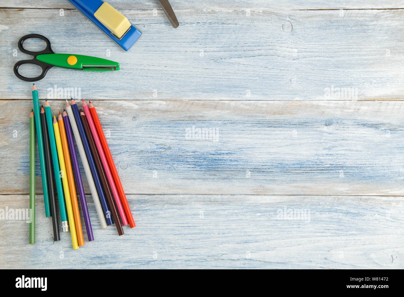 school children's concept. colored pencils,stapler and scissors on a ...
