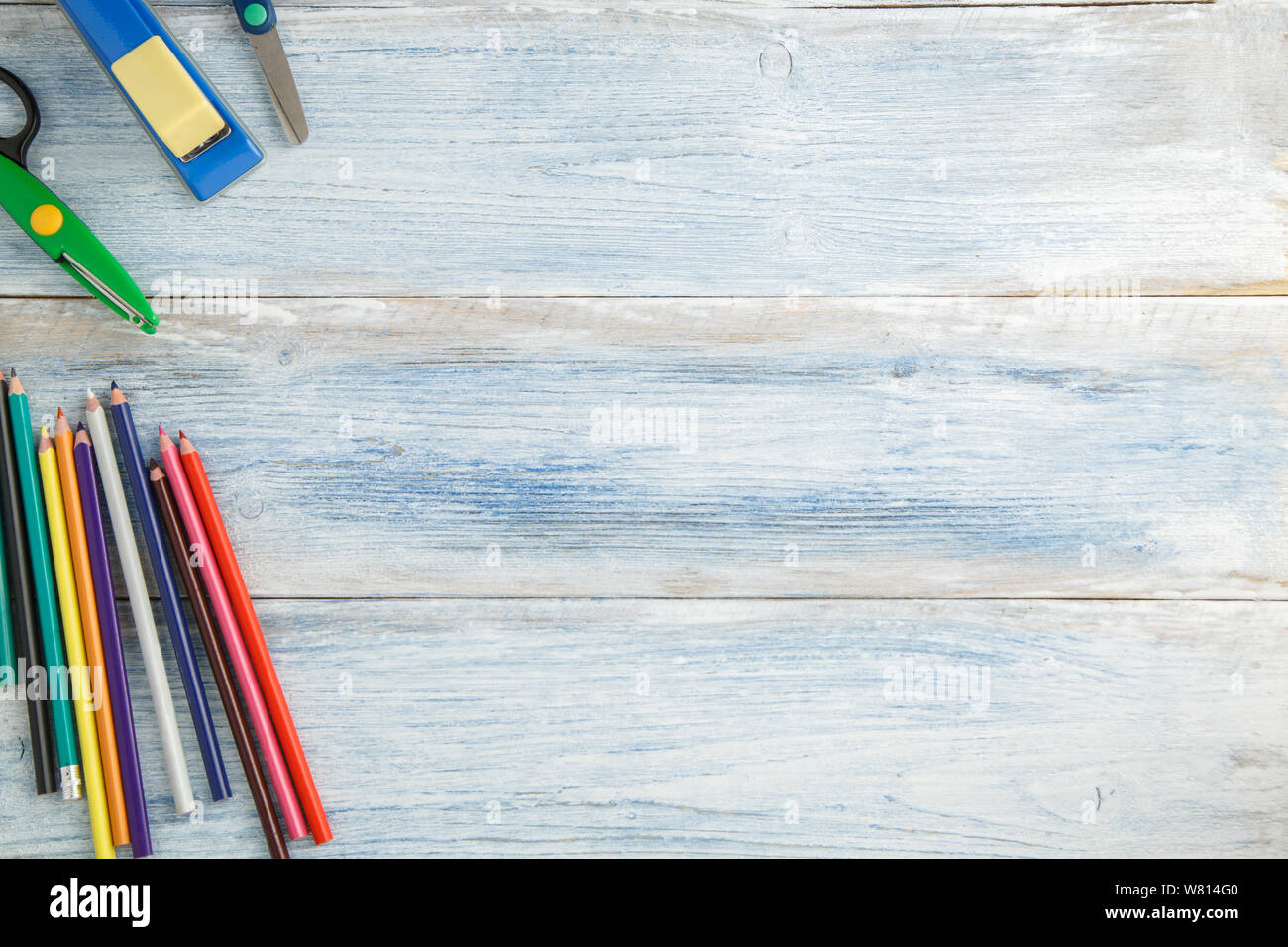 school children's concept. colored pencils,stapler and scissors on a ...
