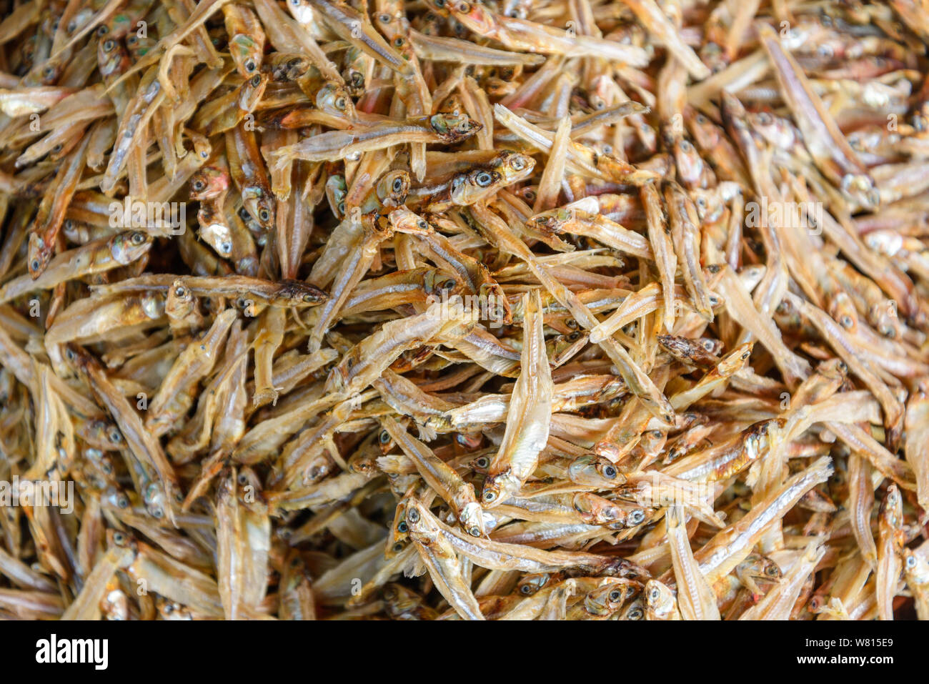 Close up view stack of small dried fish in outdoor seafood market Stock ...