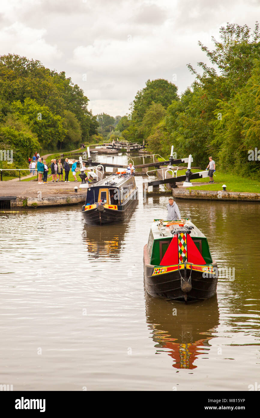 Canal narrow boat passing through Hatton locks on the Grand Union Canal ...