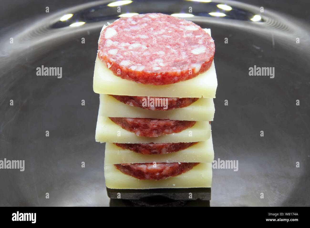 Salami and cheese snack. Snack food. Small bites of salami and cheese ...